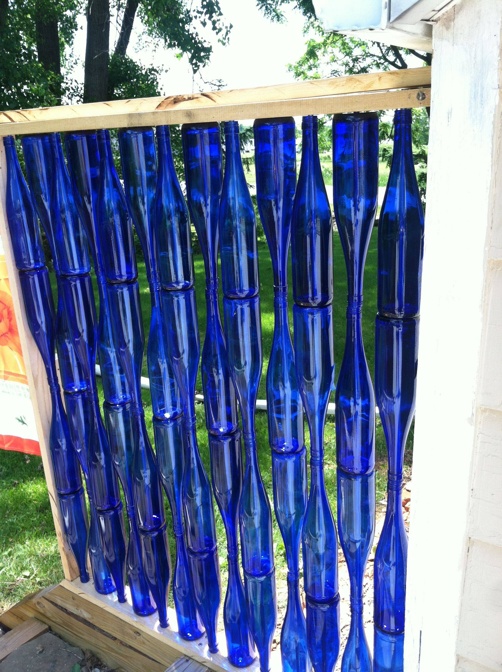 24 Wine Bottle Wall Garden Ideas To Try This Year | SharonSable