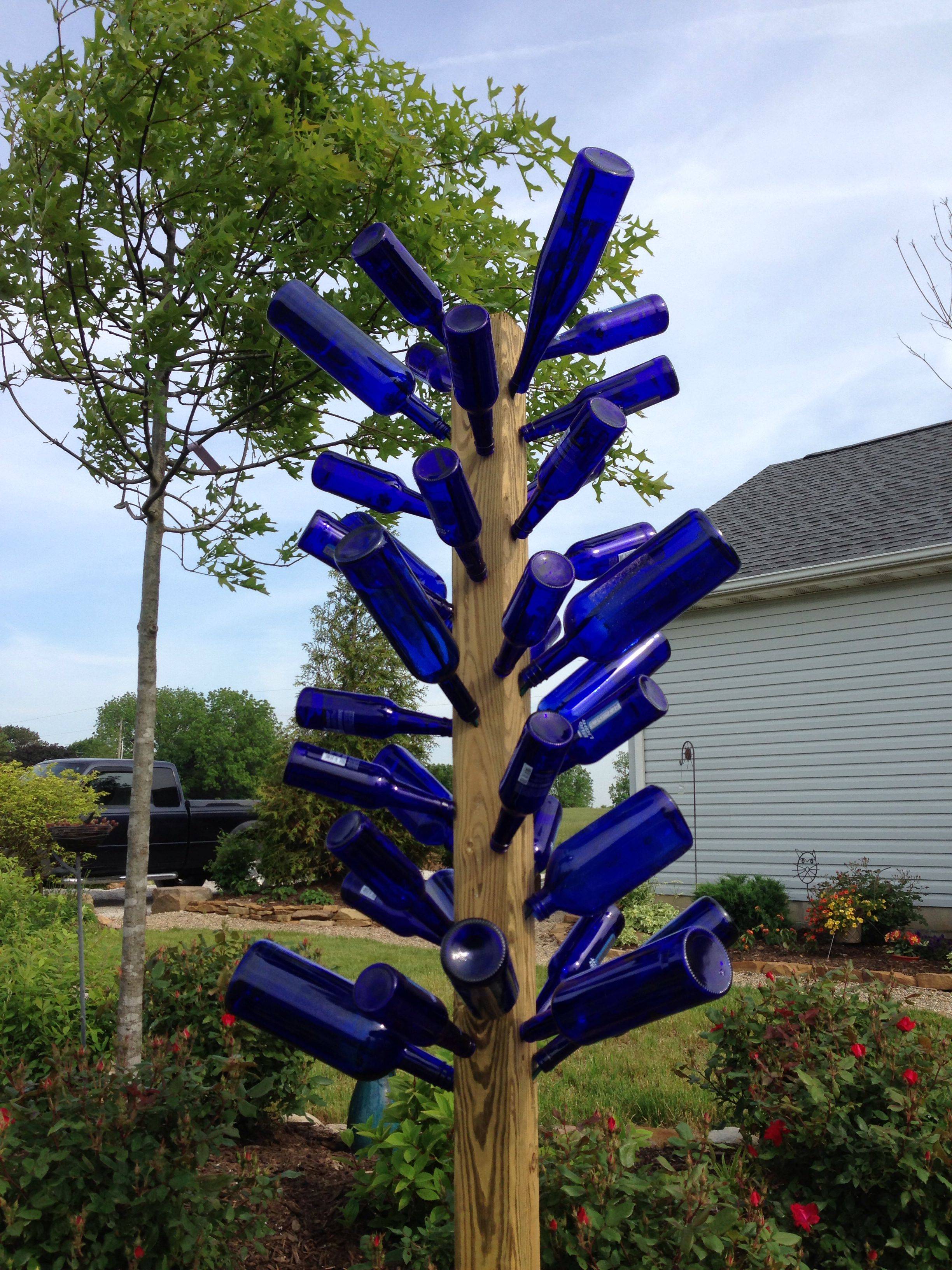 21 Garden Bottle Tree Ideas To Try This Year | SharonSable